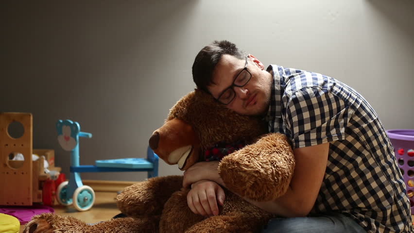 tired man hugs teddybear Stock Footage Video (100% Royalty-free ...
