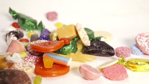 Slow Motion Sweets Falling On White Stock Footage Video (100% Royalty ...