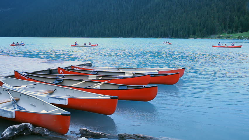 Colorful Canoes Floating On Beautiful Stock Footage Video (100% Royalty ...