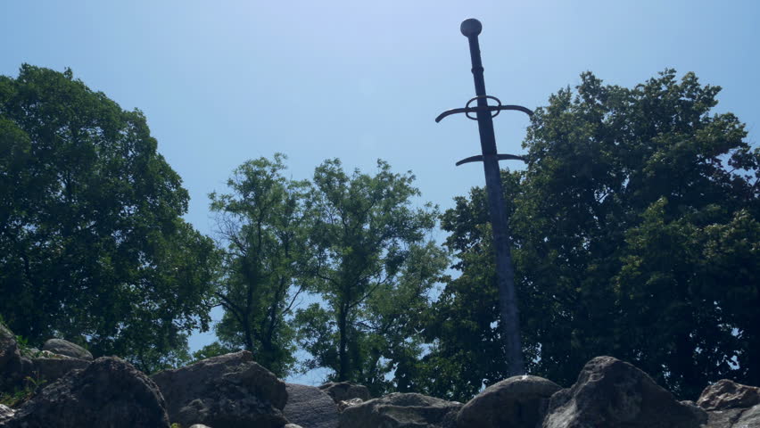Big Sword Stuck in Rock Stock Footage Video (100% Royalty-free ...