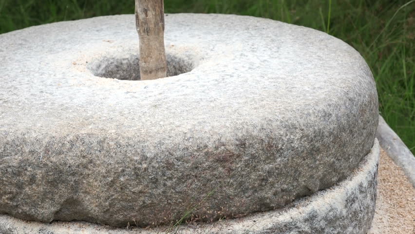 close-up shot historic hand-driven millstone grinding Stock Footage ...