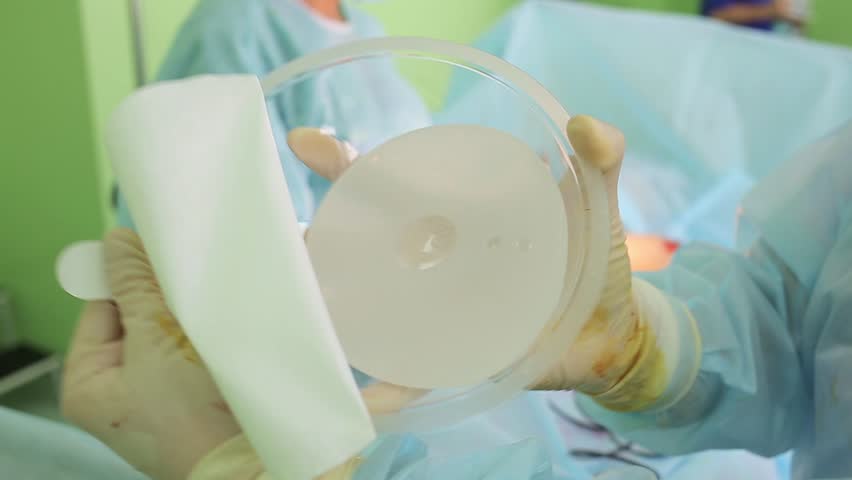 doctor shows breast implant fill solution Stock Footage Video (100% ...
