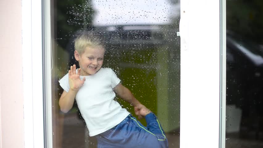 little boy by window while raining Stock Footage Video (100% Royalty ...