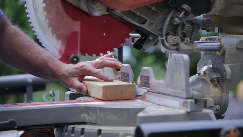man using chop saw measuring outside Stock Footage Video (100% Royalty ...