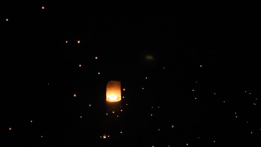 Fire Lanterns Floating up into the sky at night at Loi Krathong ...