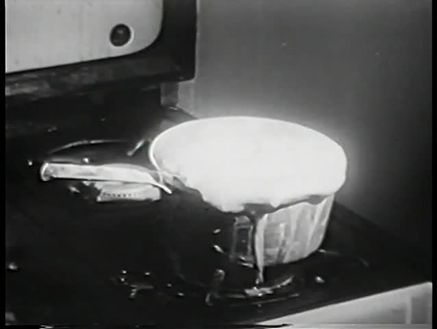 milk boiling over pot spilling on Stock Footage Video (100% Royalty ...