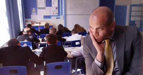 4k Portrait Depressed Teacher Classroom Students Stock Footage Video ...