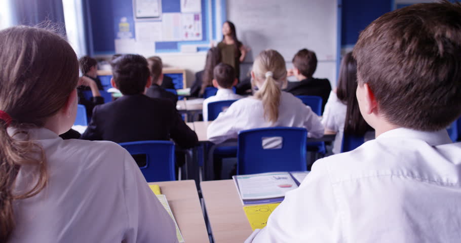 4k attractive female teacher teaching classroom: Stockvideos ...