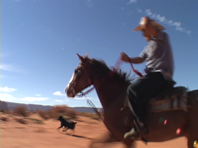 cowboy on horseback rides fast across Stock Footage Video (100% Royalty ...