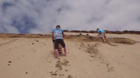 Boys Sandboarding On Dunes Oregon Stock Footage Video (100% Royalty ...
