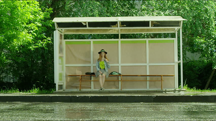 girl sitting alone bus stop : วิดีโอสต็อก (ปลอดค่าลิขสิทธิ์ 100% ...