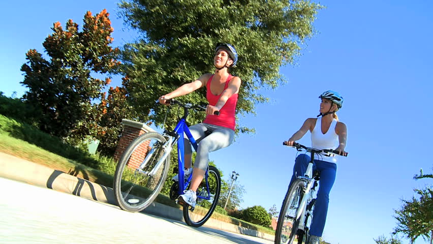 Young Female Friends Cycling Together Stock Footage Video (100% Royalty ...