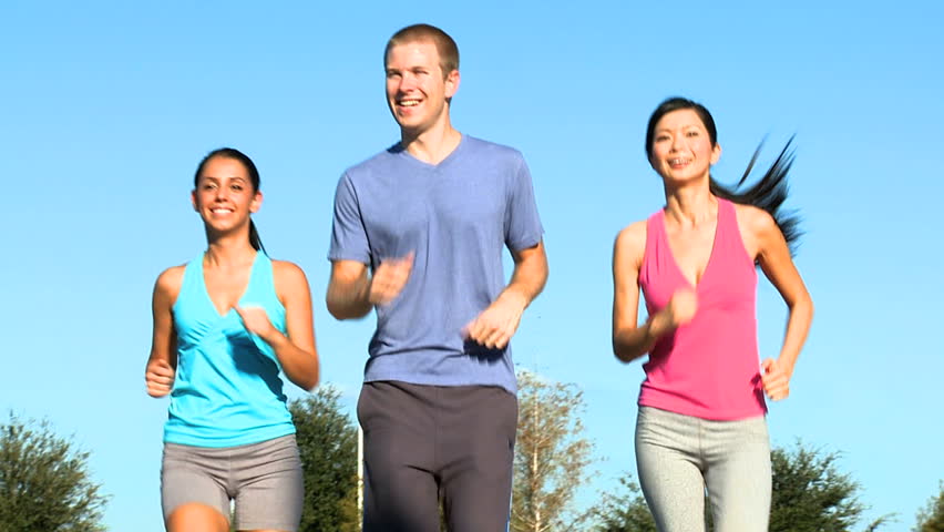 three fit young people keeping jogging Stock Footage Video (100% ...