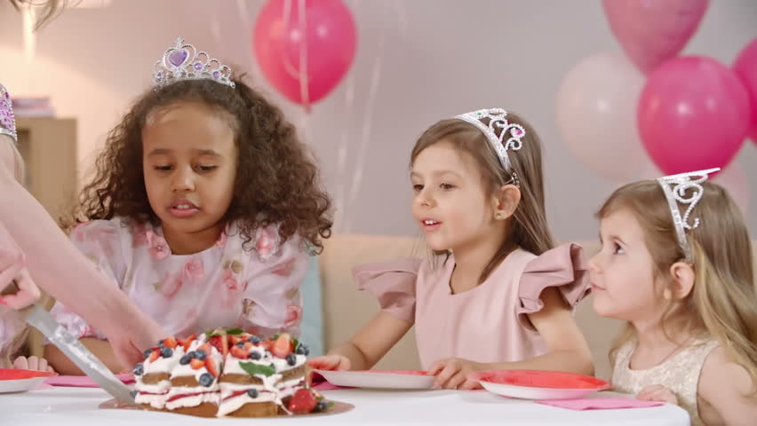 cute little girls sitting birthday table: video de stock (totalmente ...