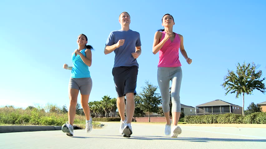 three fit young people keeping jogging Stock Footage Video (100% ...