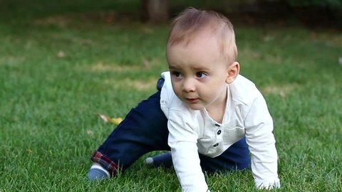 Little Pretty Child Plays On Lawn Stock Footage Video (100% Royalty ...