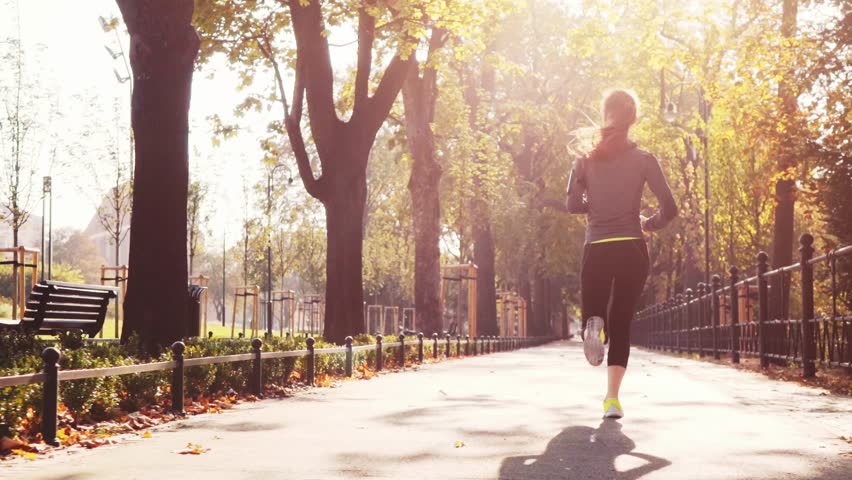 runner woman running sunny city park Stock Footage Video (100% Royalty ...