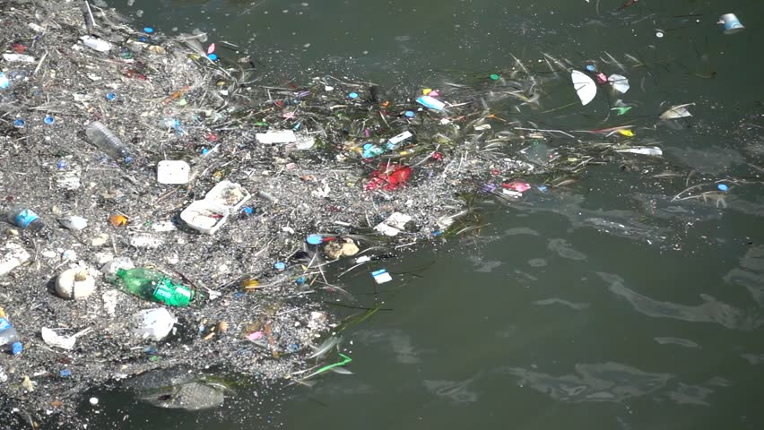 trash garbage floating on surface water Stock Footage Video (100% ...