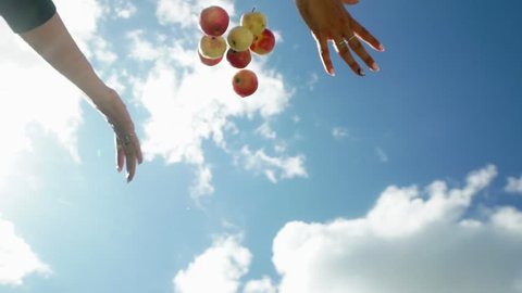 Female Hand Throw Apples On Background Stock Footage Video (100% ...