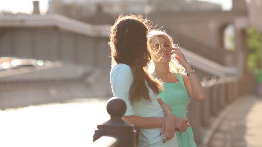 two girls standing on street talking Stock Footage Video (100% Royalty ...