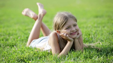 portrait smiling girl lying on grass Stock Footage Video (100% Royalty ...