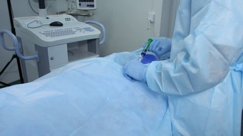 Interventional Radiologist Injecting Embolization Material Uterine ...