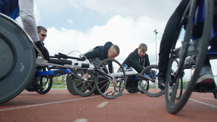 4k Smiling Disabled Athletes Racing Wheelchairs Stock Footage Video ...