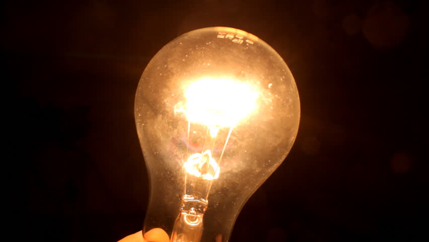 Lit Lightbulb Held in Hand Stock Footage Video (100% Royalty-free ...