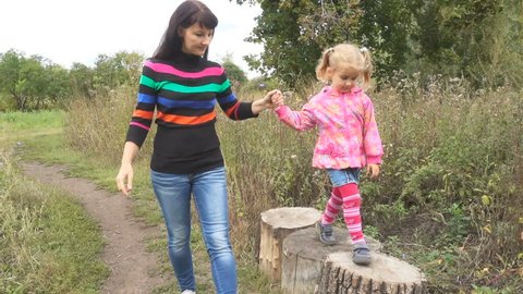 Little Baby Girl Walking On Stumps Stock Footage Video (100% Royalty ...