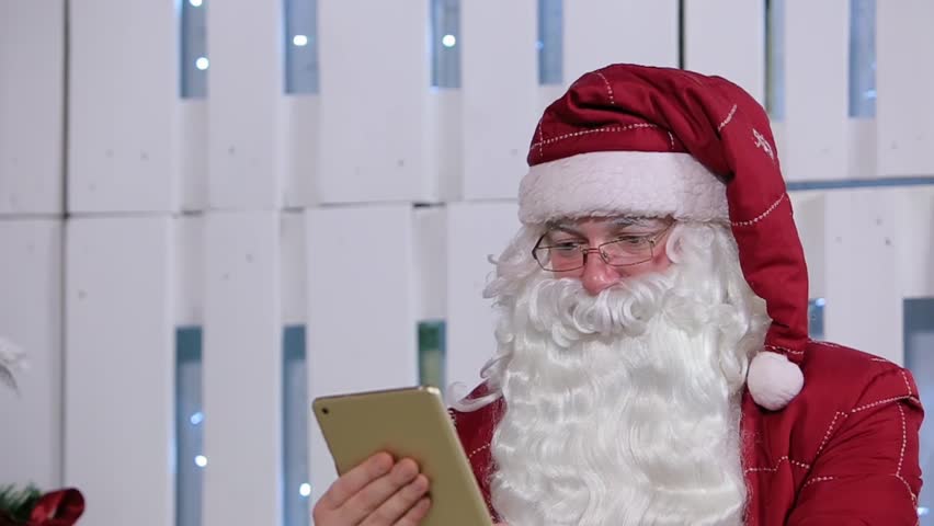 santa claus flipping page on digital Stock Footage Video (100% Royalty ...