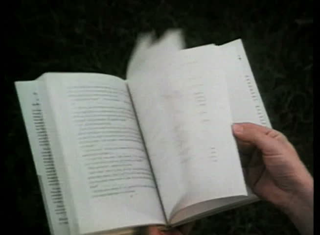 Close-up of Person Flipping Through Stock Footage Video (100% Royalty ...