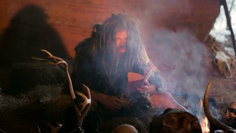 Prehistoric Caveman Reads Book Stock Footage Video (100% Royalty-free ...