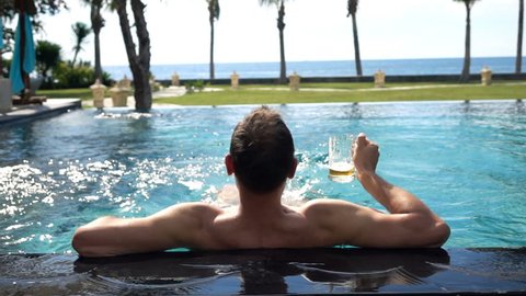 Man Beer Relaxing Swimming Pool Garden Stock Footage Video (100% ...