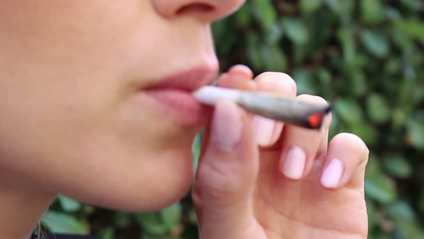 young woman smoking marijuana joint green Stock Footage Video (100% Royalty-free) 21258952 ...