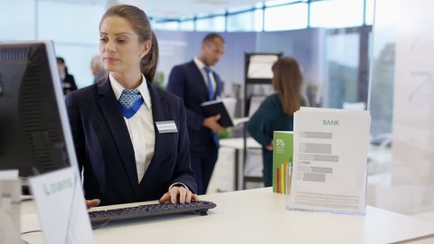 4k Bank Worker Service Desk Assists Stock Footage Video (100% Royalty ...
