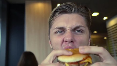 Young Attractive Man Eating Fast Food Stock Footage Video (100% Royalty ...