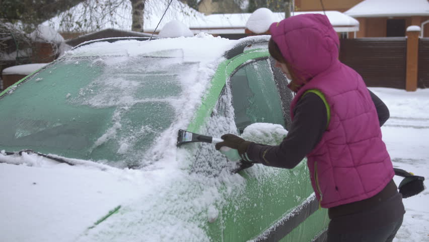 Young Woman Cleaning Snow and Stock Footage Video (100% Royalty-free ...