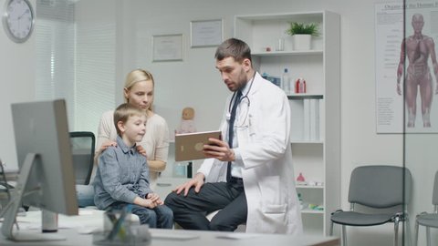 Male Doctor Checks Young Boys Muscle Stock Footage Video (100% Royalty ...