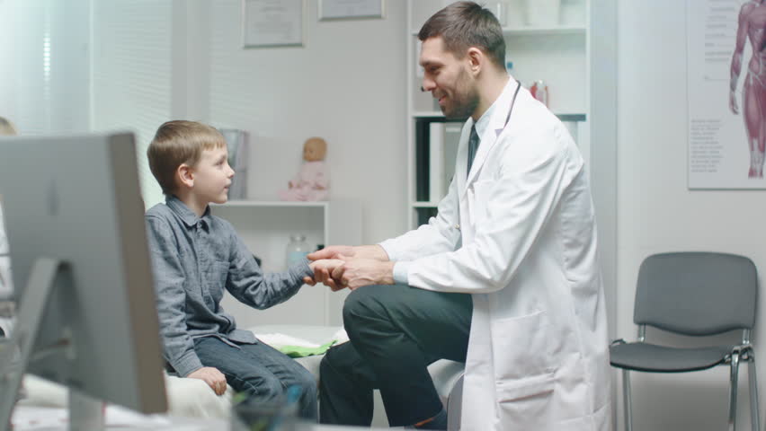 Male Doctor Checks Young Boys Muscle Stock Footage Video (100% Royalty ...