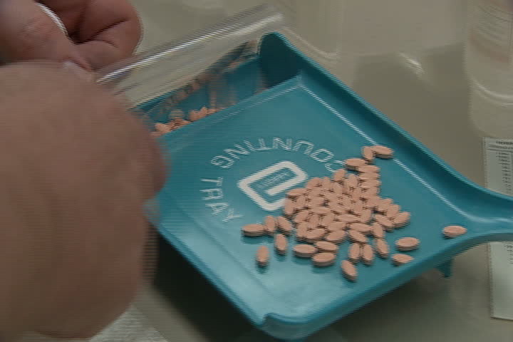 A Pharmacist Sorting Pills. Stock Footage Video (100% Royalty-free ...