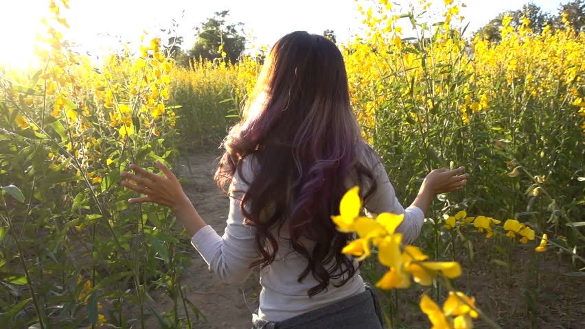 women running through field flowers Stock Footage Video (100% Royalty ...