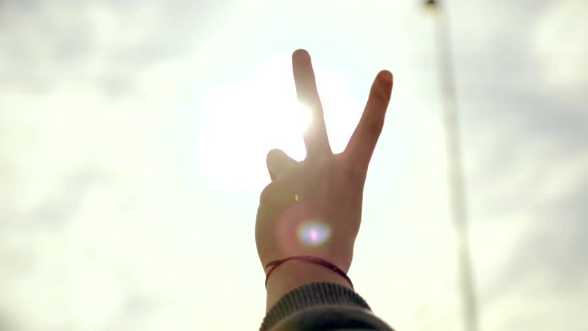 male hand doing peace victory sign Stock Footage Video (100% Royalty ...