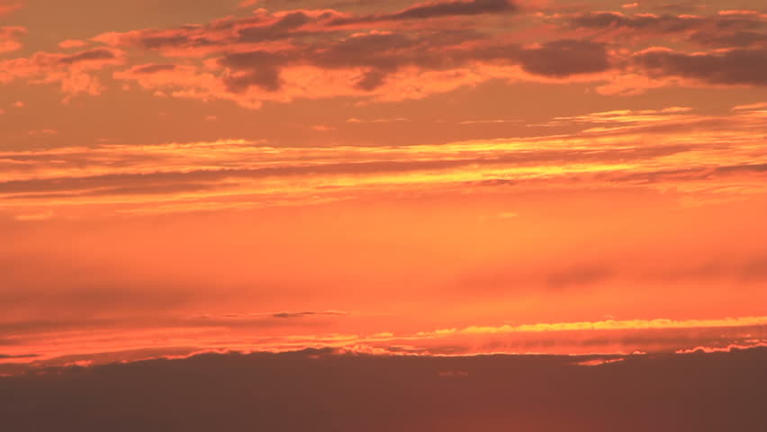 warm colored clouds darkening twilight sky Stock Footage Video (100% ...