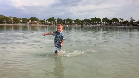 Child Run Down Beach Slow Motion Stock Footage Video (100% Royalty-free ...