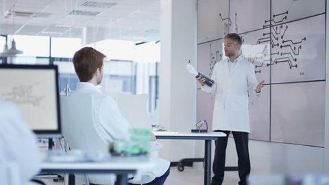 4k Senior Electronics Engineer Talking Students Stock Footage Video ...