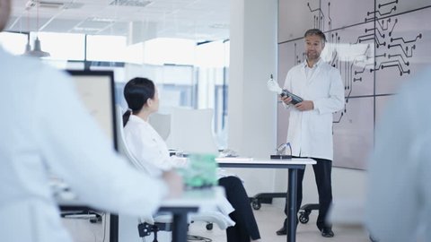 team research scientists working on computer Stock Footage Video (100% ...