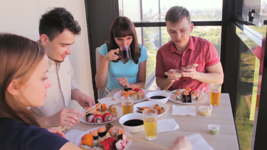 happy family sitting around kitchen table Stock Footage Video (100% ...