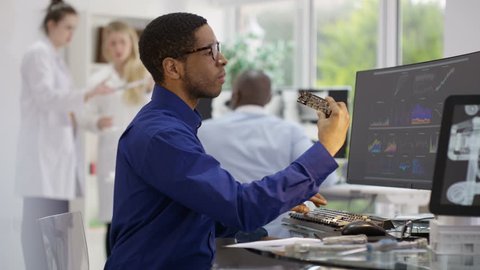 4k Scientific Research Engineers Analyzing Technical Stock Footage ...