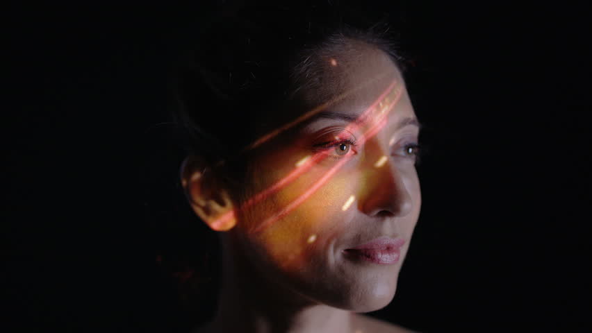 4k light projected onto woman's face Stock Footage Video (100% Royalty ...