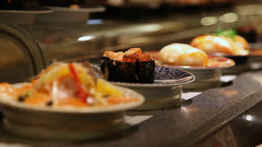 conveyor belt sushi rotating japanese restaurant Stock Footage Video ...